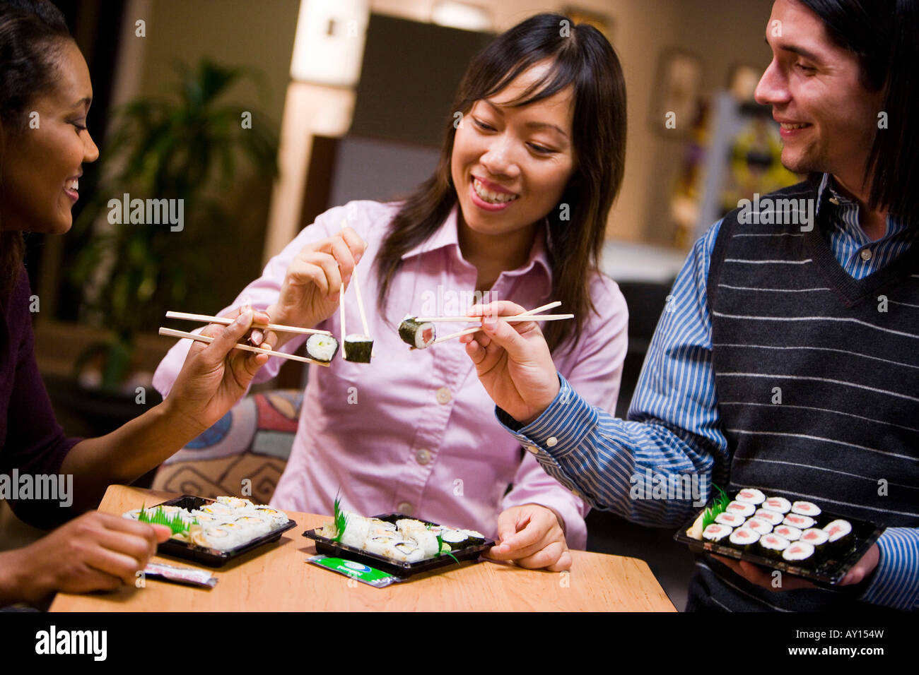 People sitting and eating food Stock Photo - Alamy