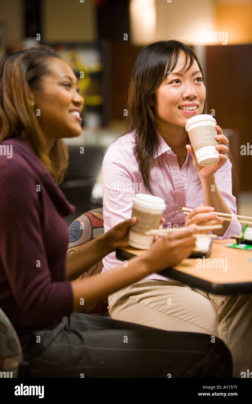 Woman sitting table eating food hi-res stock photography and images - Alamy