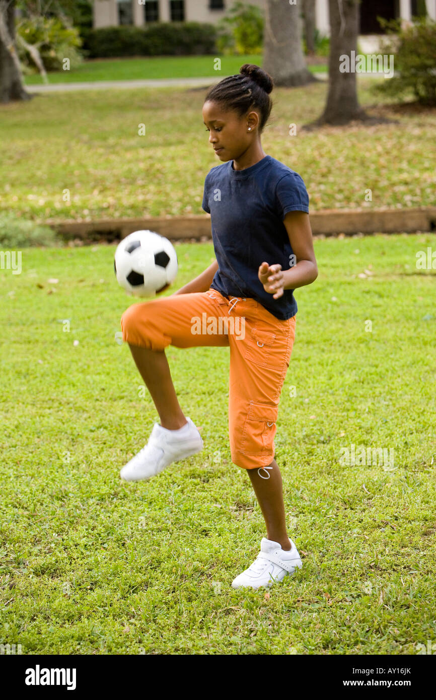 Girl on bouncing ball playing hi-res stock photography and images - Alamy
