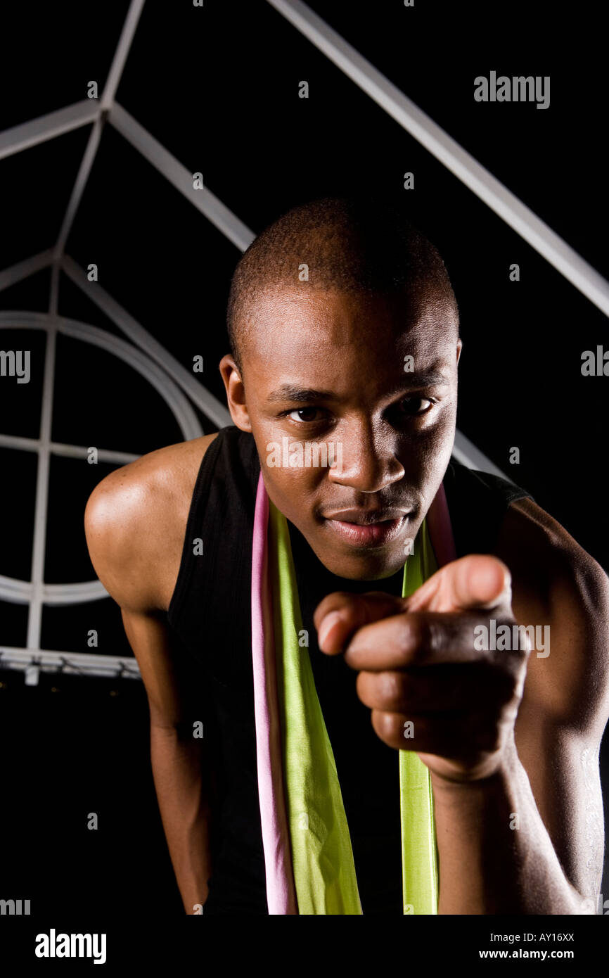 Portrait of a cheerful man pointing out finger Stock Photo - Alamy