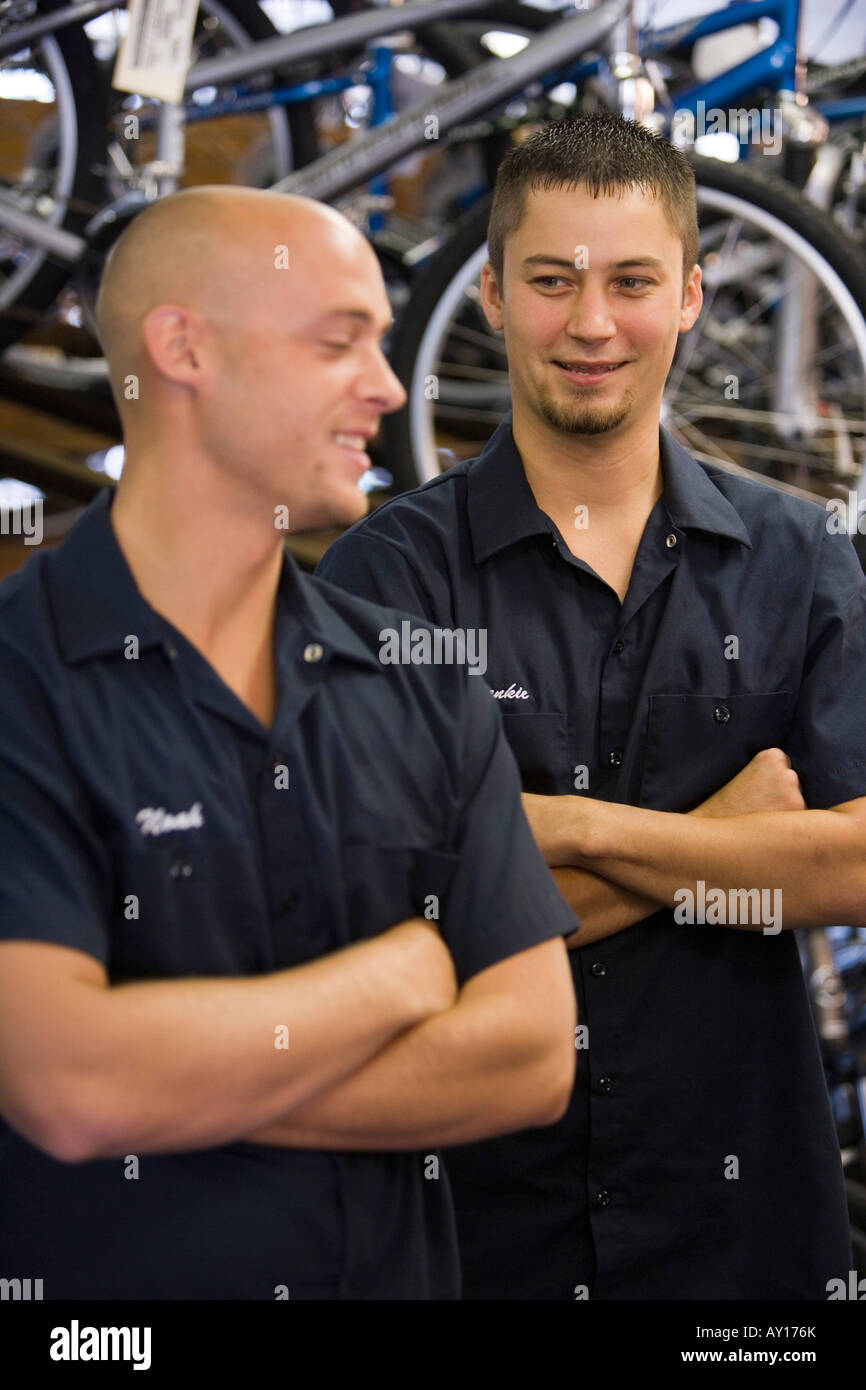 Men smiling in a bicycle shop Stock Photo - Alamy