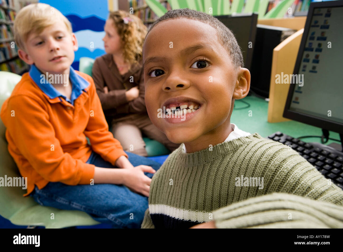 Three children sitting on a keyboard hi-res stock photography and ...