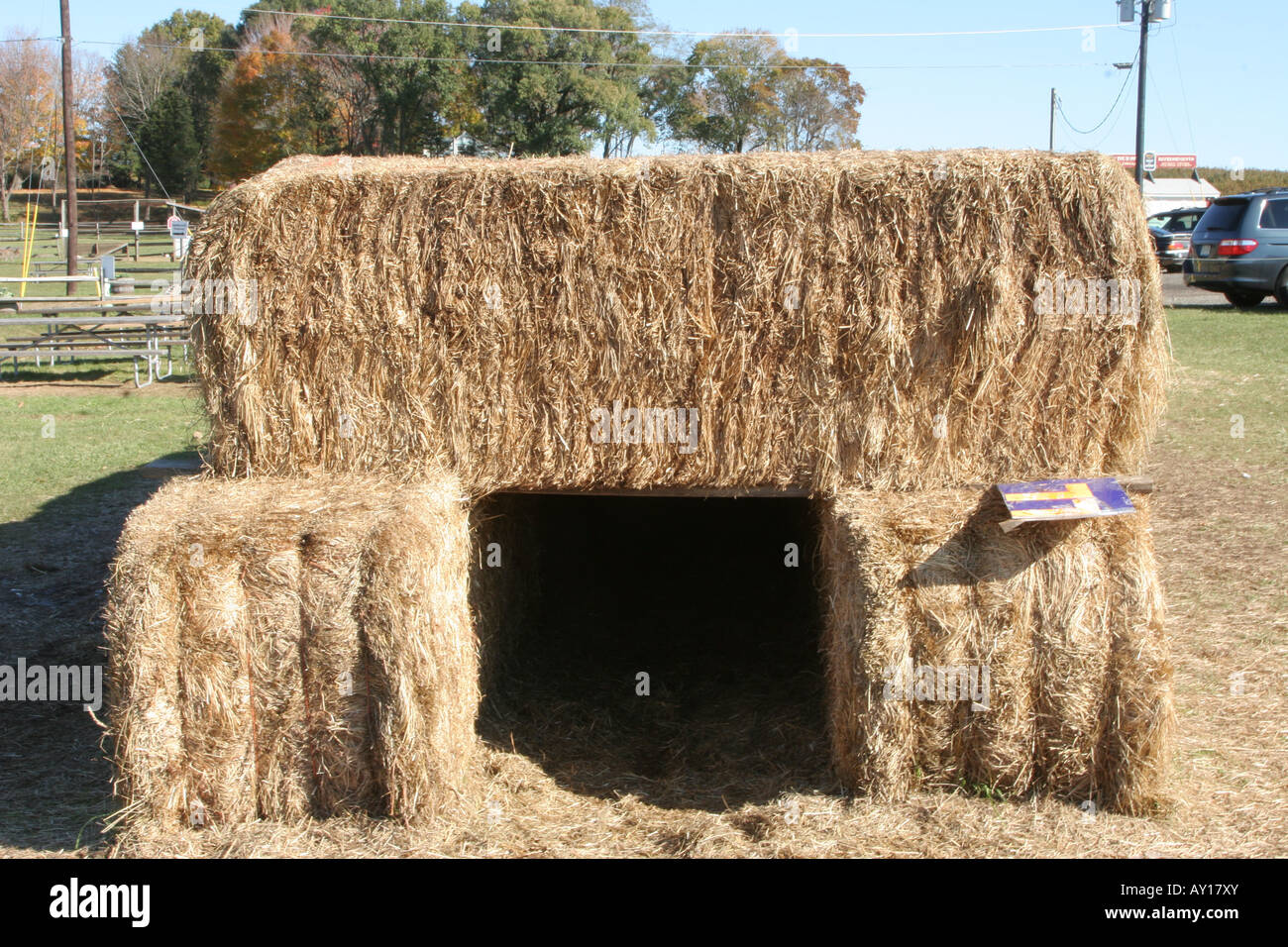 hay bale stack with crawl space Stock Photo - Alamy