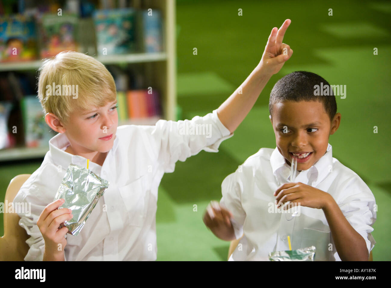 Students having refreshment in the library Stock Photo - Alamy