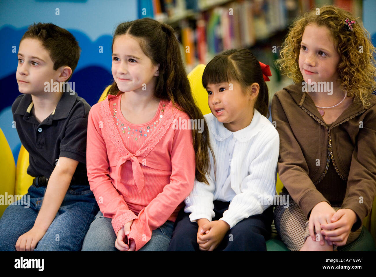 Students sitting side by side in the library Stock Photo - Alamy
