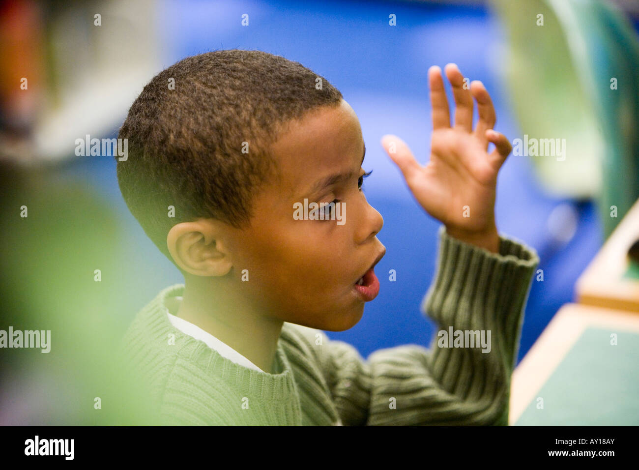 Side view of a boy gesturing Stock Photo - Alamy