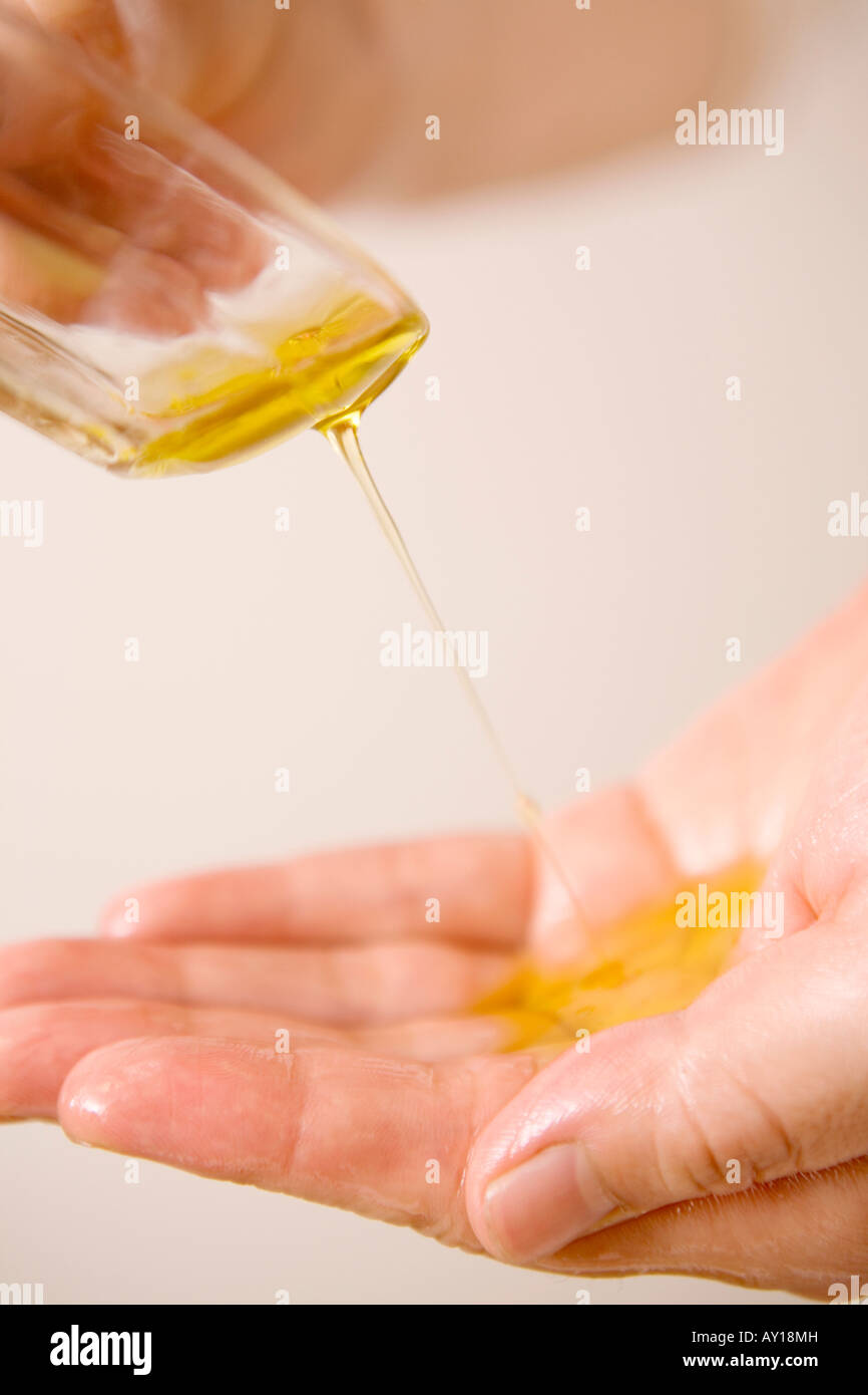 Palm of the hand receiving oil Stock Photo - Alamy