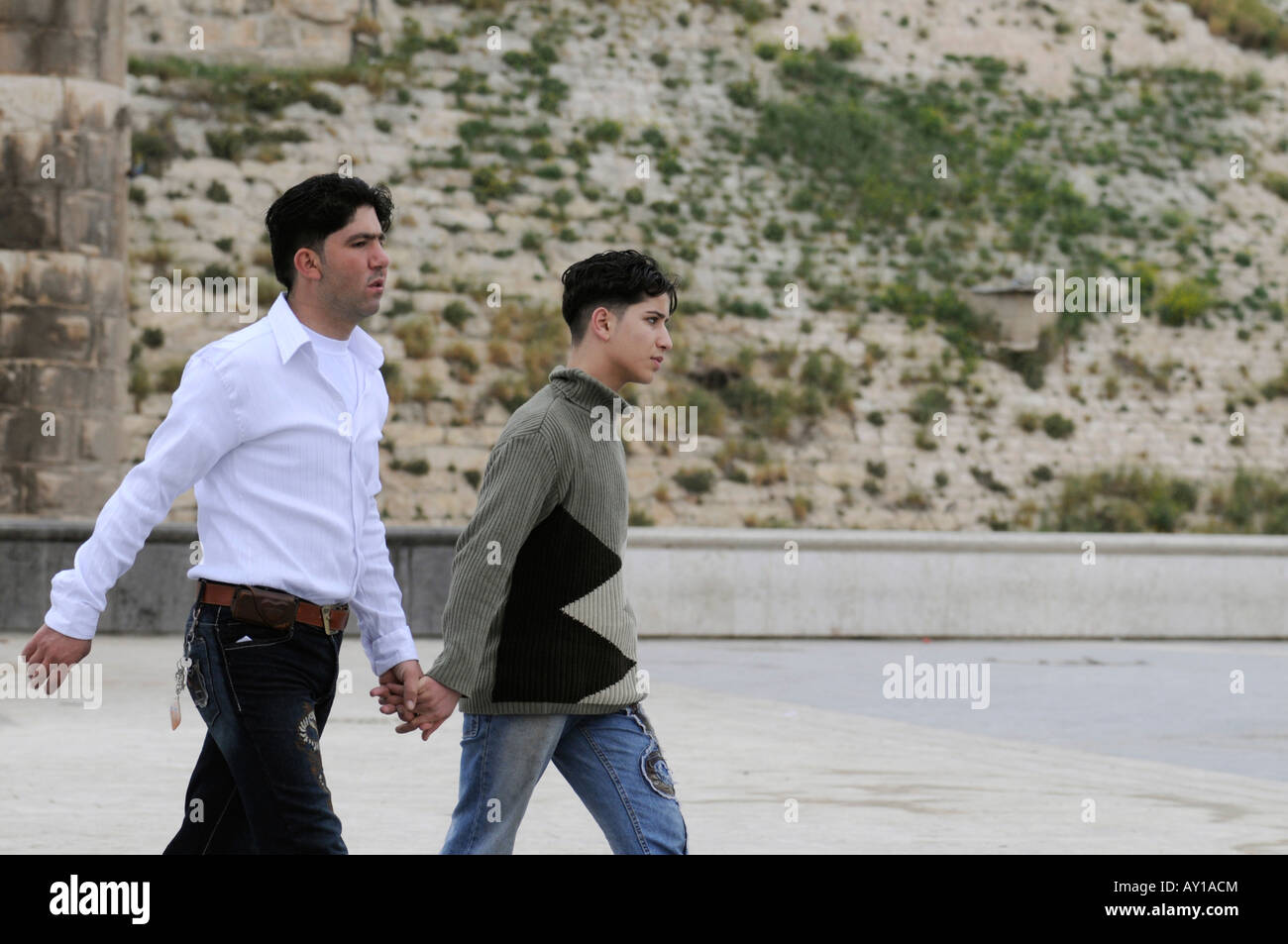 Arab men holding hands hi-res stock photography and images - Alamy