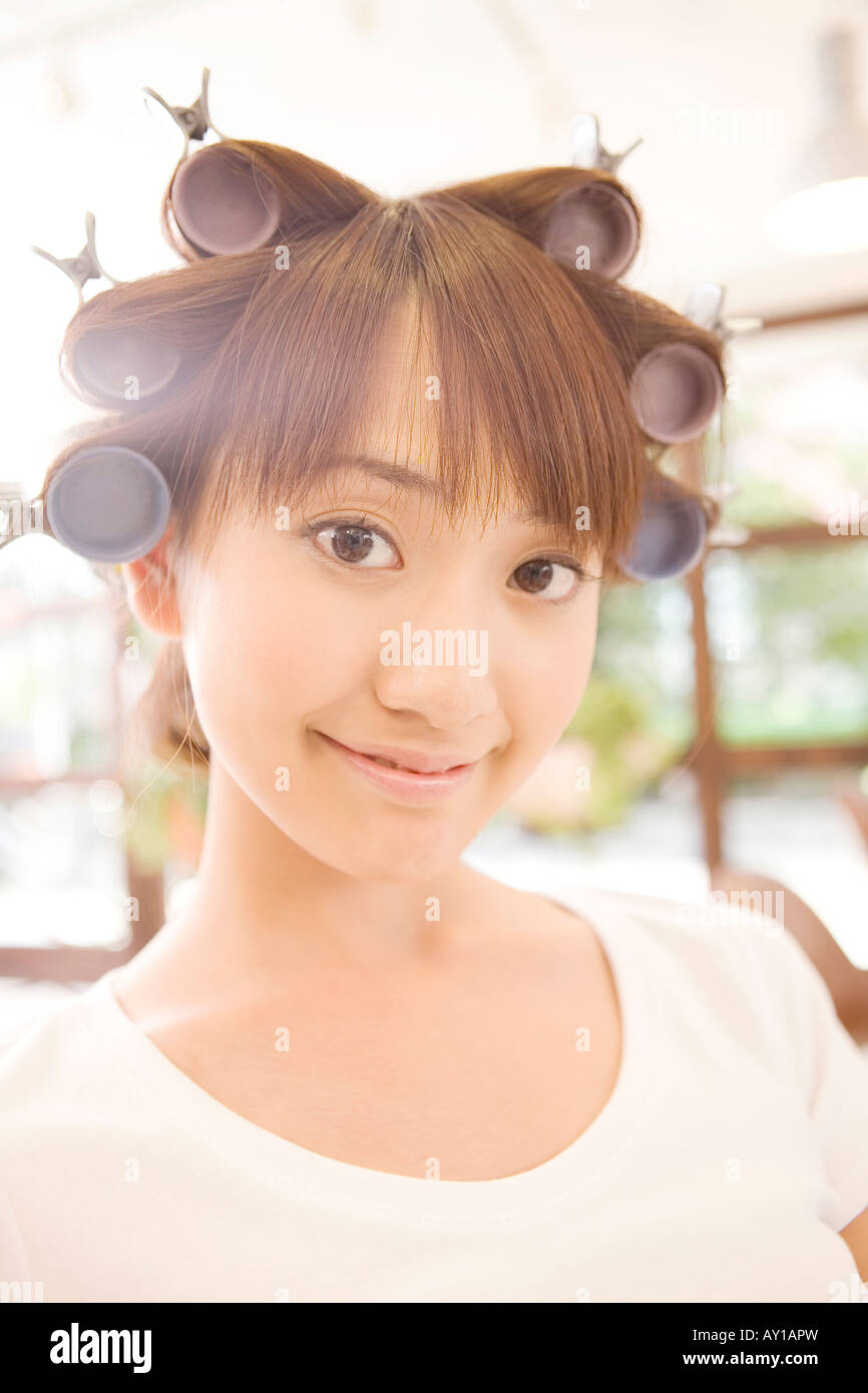 Japanese girl in the beauty parlor for a perm Stock Photo - Alamy
