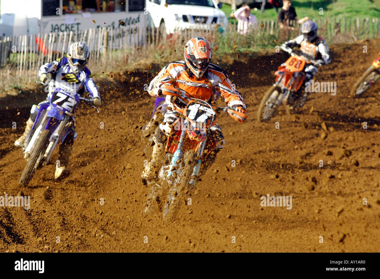 a guy rider on a motocross bile motorcycle jumping and racing big air ...