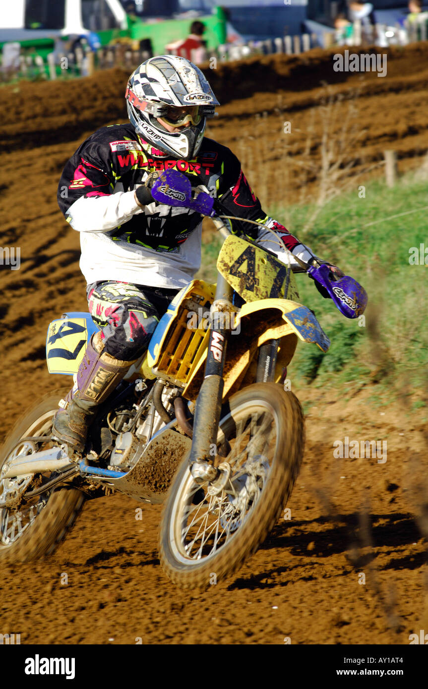 a guy rider on a motocross bile motorcycle jumping and racing big air ...