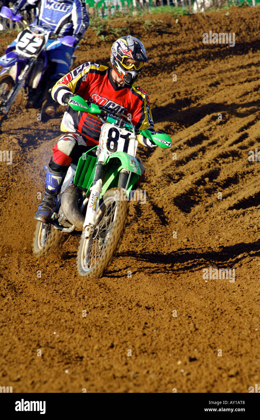 a guy rider on a motocross bile motorcycle jumping and racing big air ...