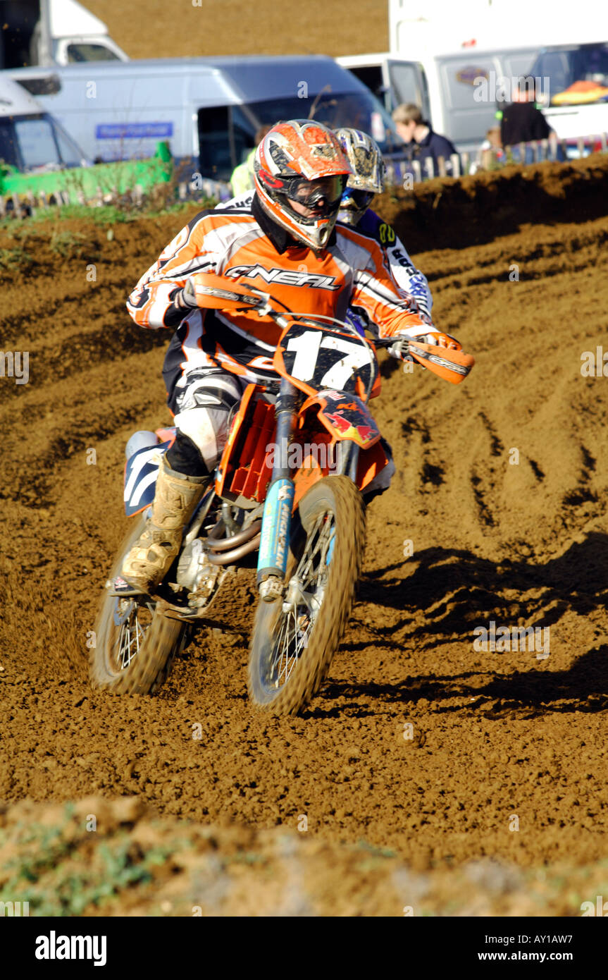 a guy rider on a motocross bile motorcycle jumping and racing big air ...