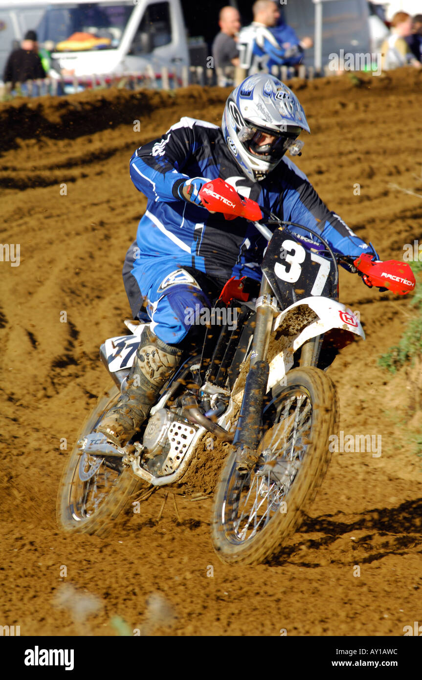 a guy rider on a motocross bile motorcycle jumping and racing big air ...