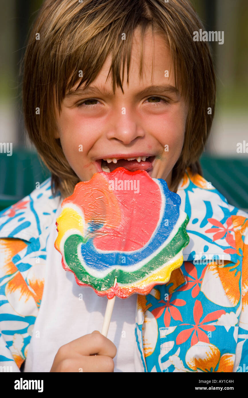 Portrait of a boy eating lollipop Stock Photo - Alamy