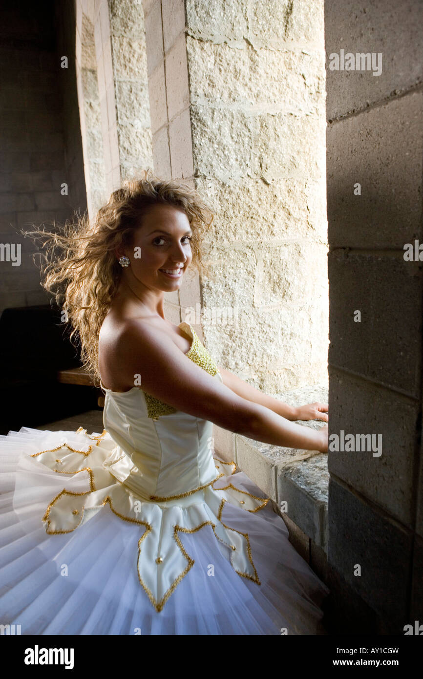 Portrait of a cheerful ballet dancer standing by window Stock Photo - Alamy