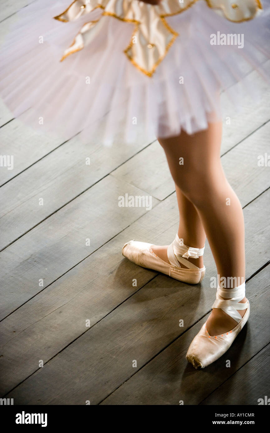 Low section of a ballet dancer standing Stock Photo - Alamy