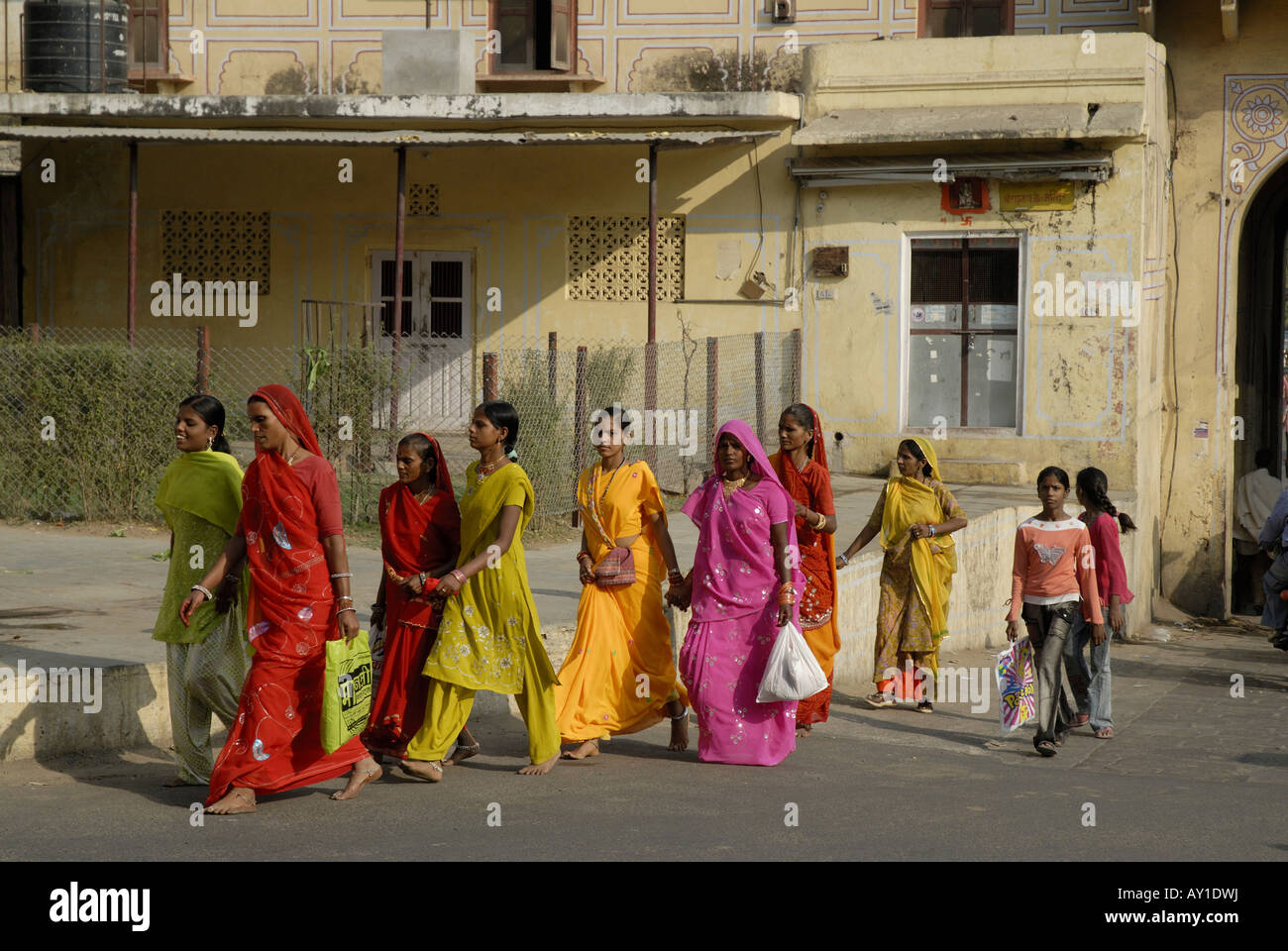 Hindu Ladies in colourful saris walking from Temple after worship ...