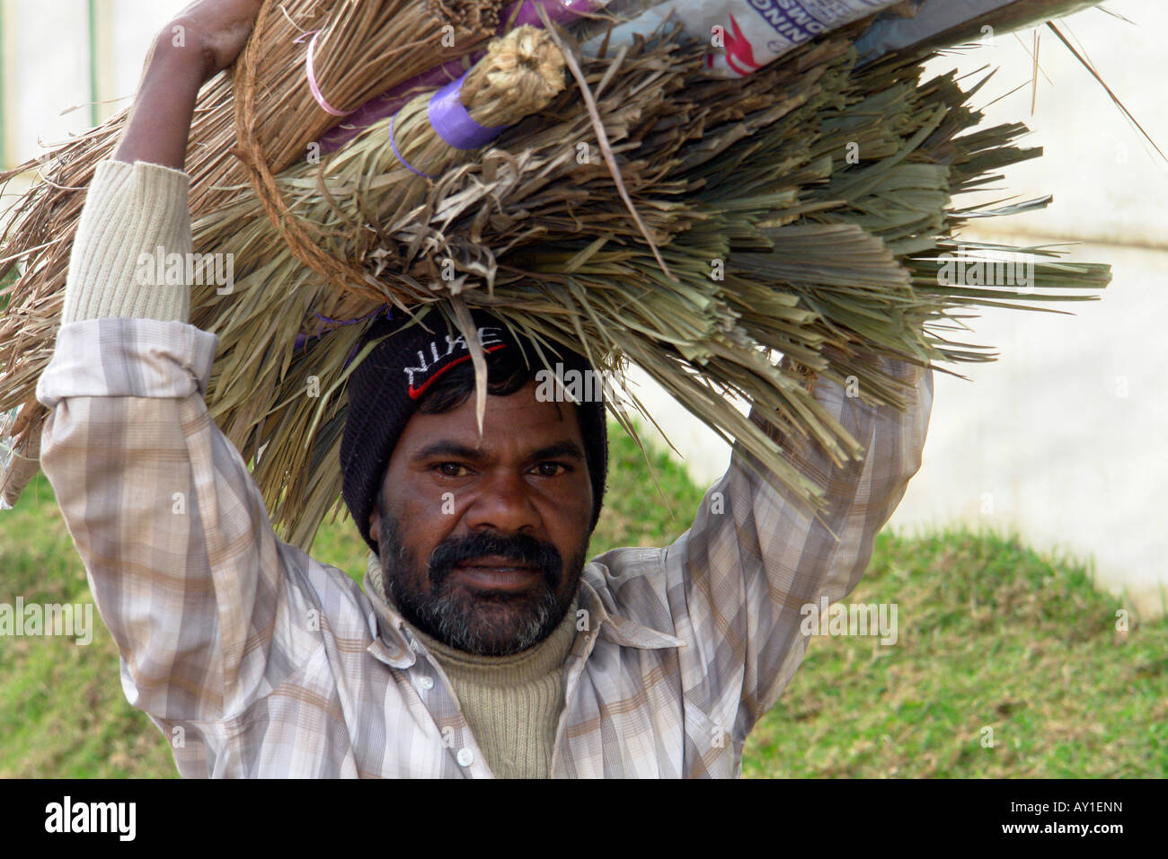 indian man carrying produce on his head at a village near ooty Stock ...