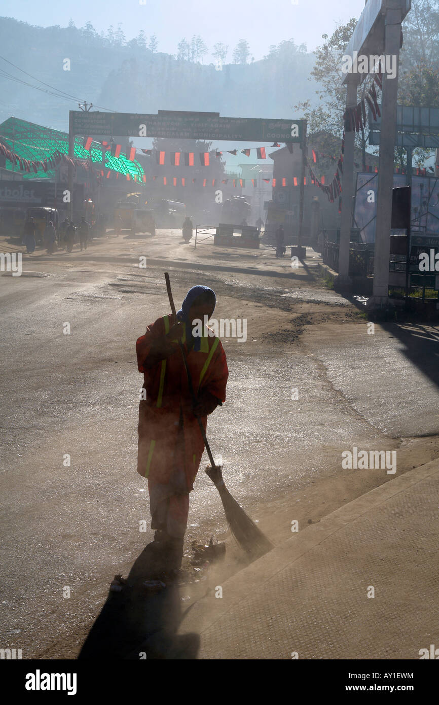 woman sweeping the streets at ooty Stock Photo - Alamy