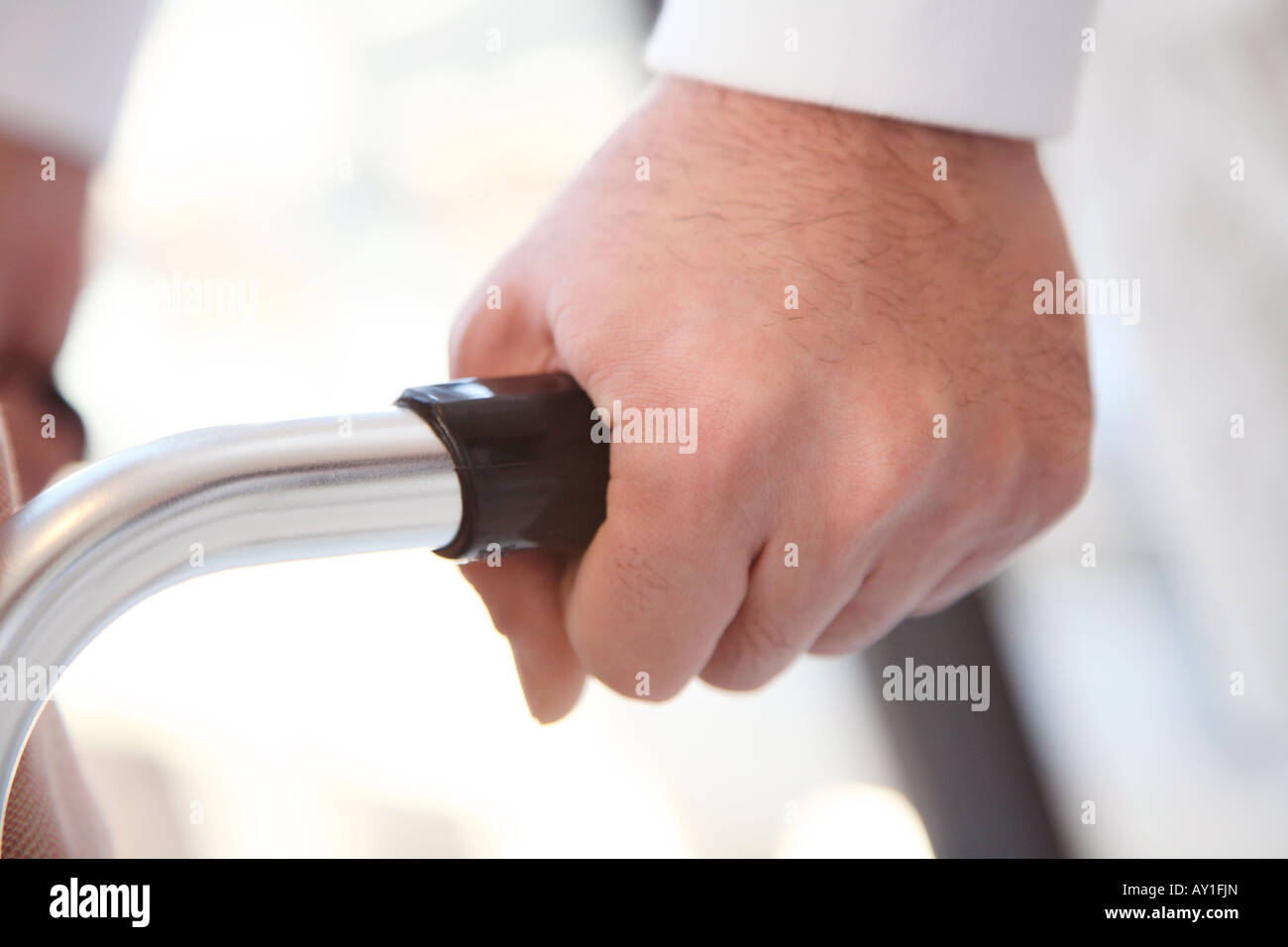 Hand gripping a handrail Stock Photo - Alamy