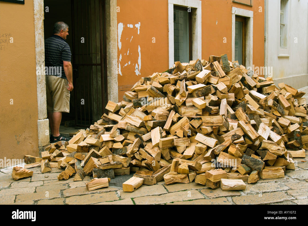 Pile of split log firewood in front of house just after delivery Stock ...