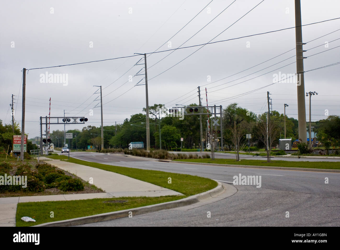 Railroad Crossing at Busy Roadway Stock Photo - Alamy