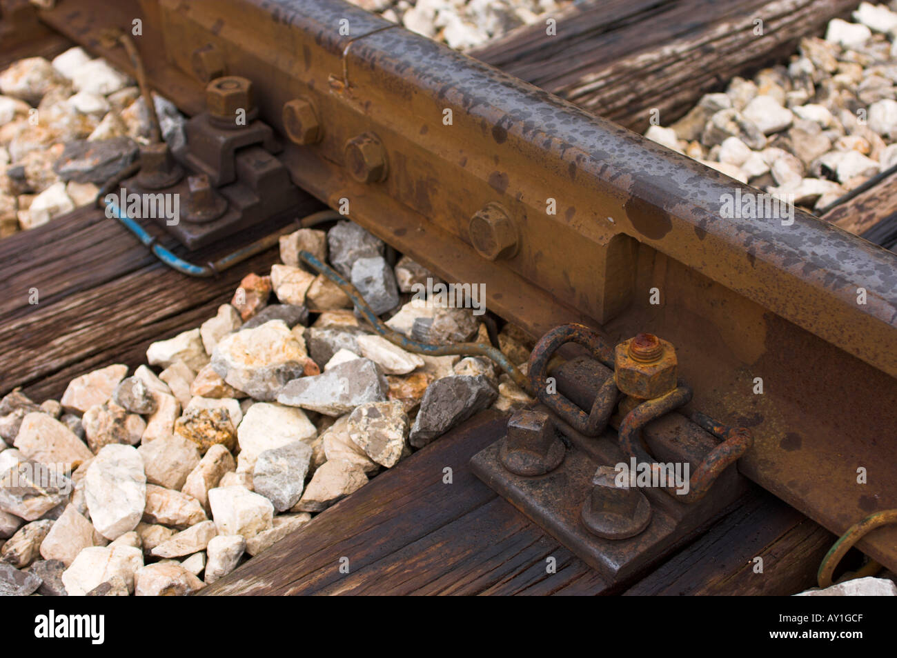 Rail and railway track locking spring Stock Photo - Alamy