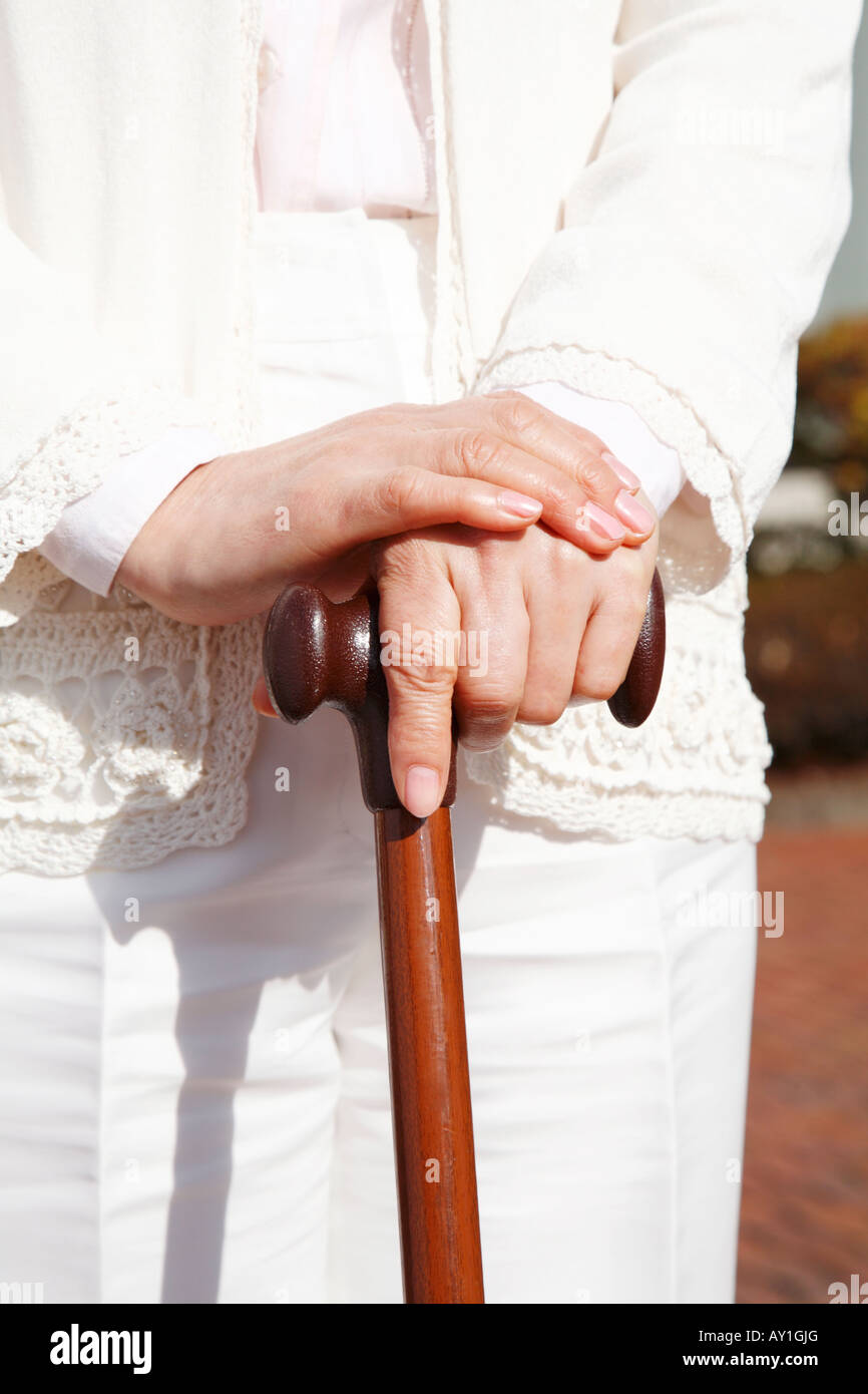 Hand gripping a cane Stock Photo - Alamy