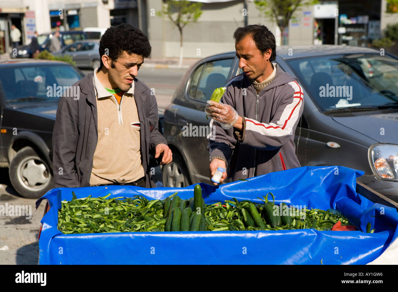 Two men at an outdoor vegetable stall in Istanbul, Turkey Stock Photo ...