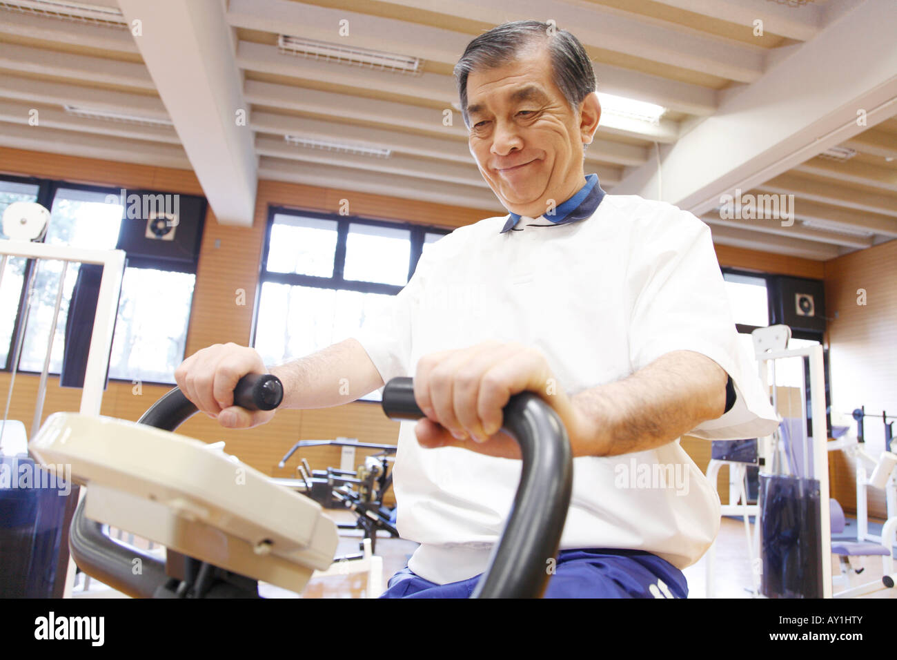 Old man doing exercise Stock Photo - Alamy
