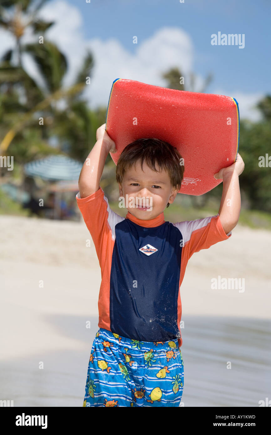 Young boy with bodyboard hi-res stock photography and images - Alamy