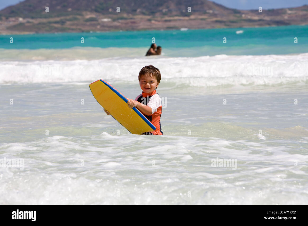 Young boy with bodyboard hi-res stock photography and images - Alamy