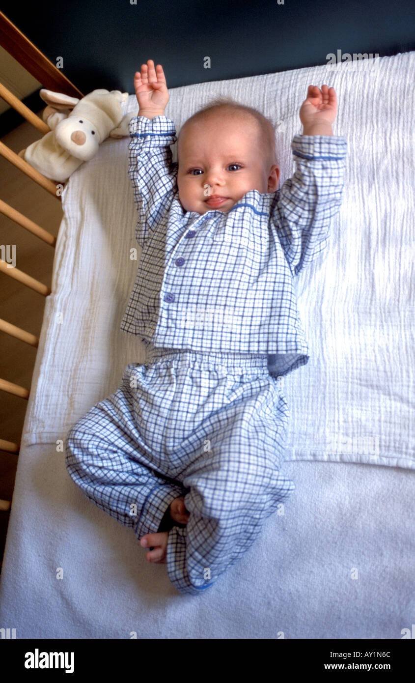 Baby stretching after waking up Stock Photo - Alamy