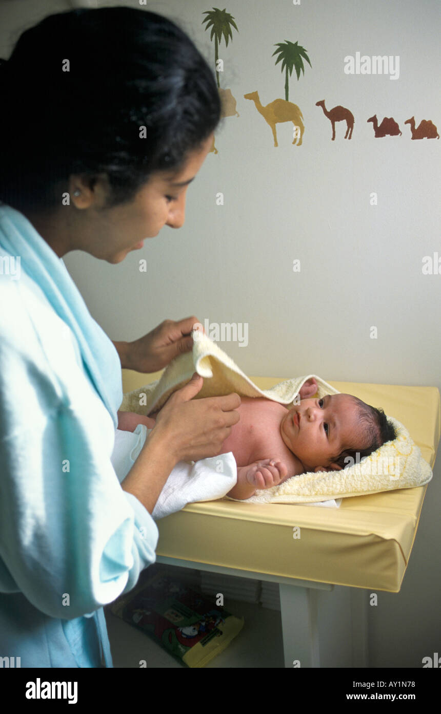 Mother dries baby after a bath Stock Photo - Alamy