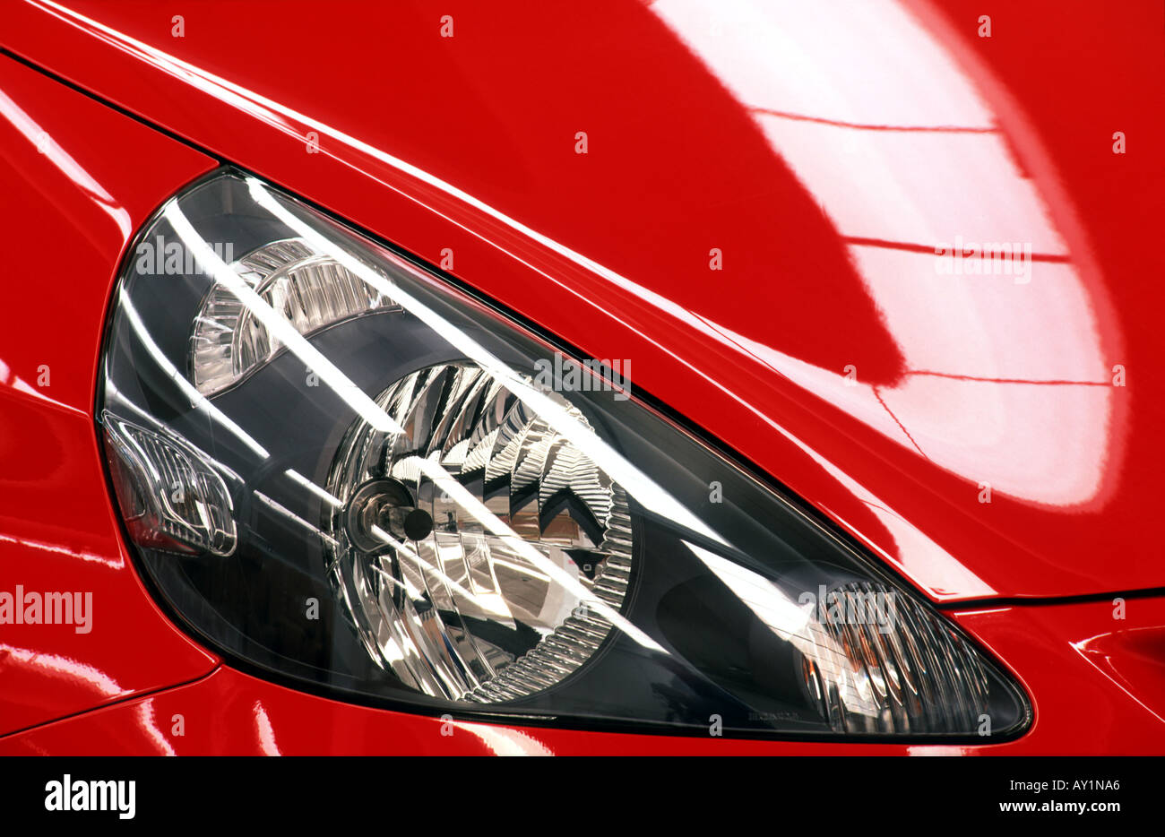 Red Honda car headlight Stock Photo - Alamy