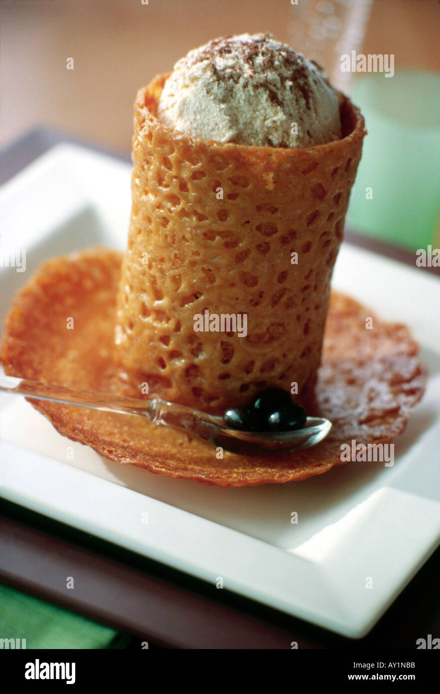 Spectacular dinner party dessert of tuile biscuits shaped into a ...