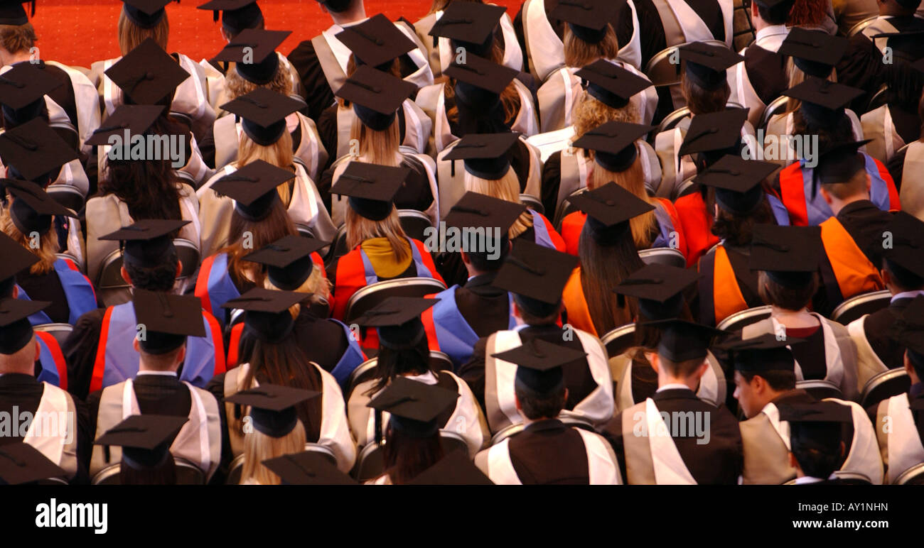 Rows of graduates waiting to receive their graduation certificates ...