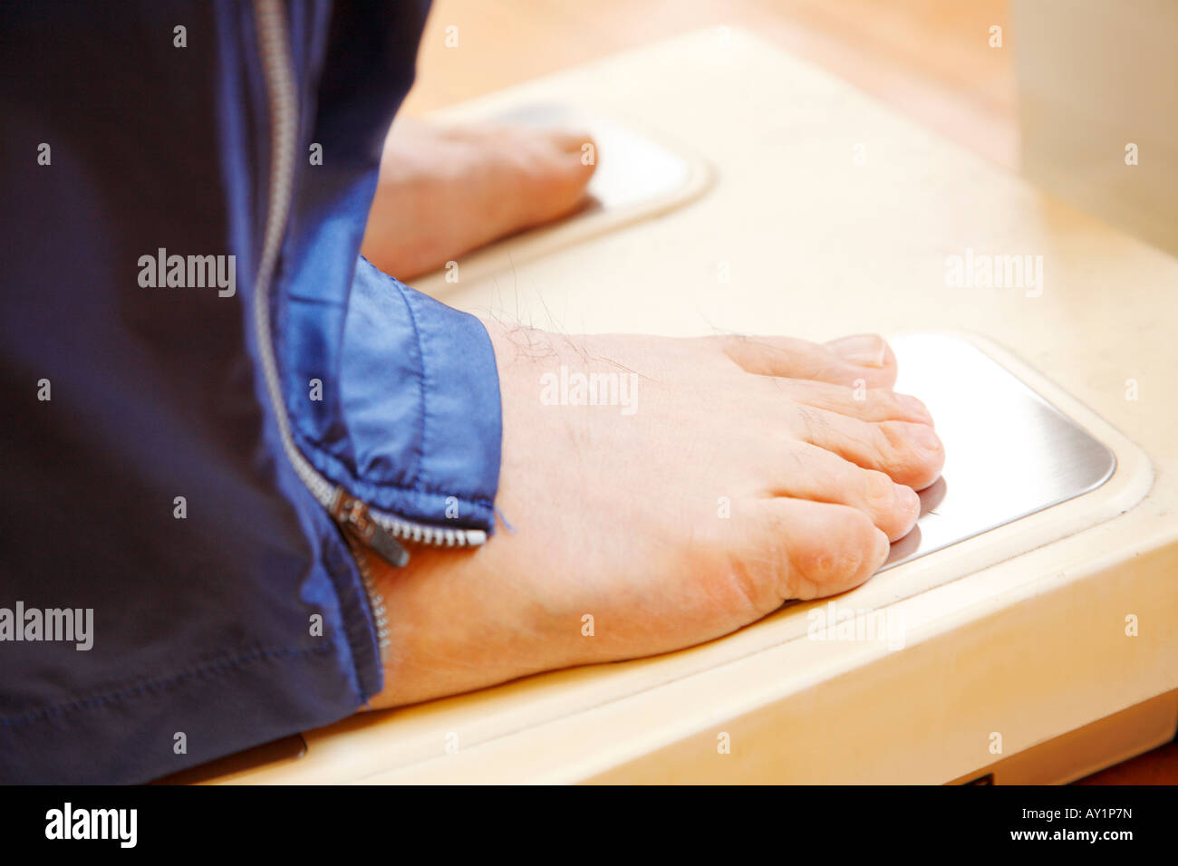 Feet stepped on the scales Stock Photo - Alamy