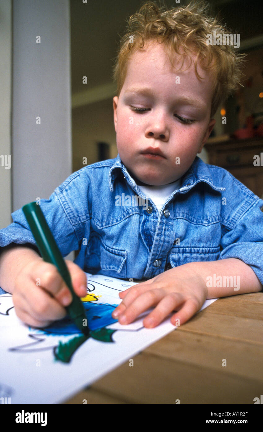 Little boy is making a drawing Stock Photo - Alamy