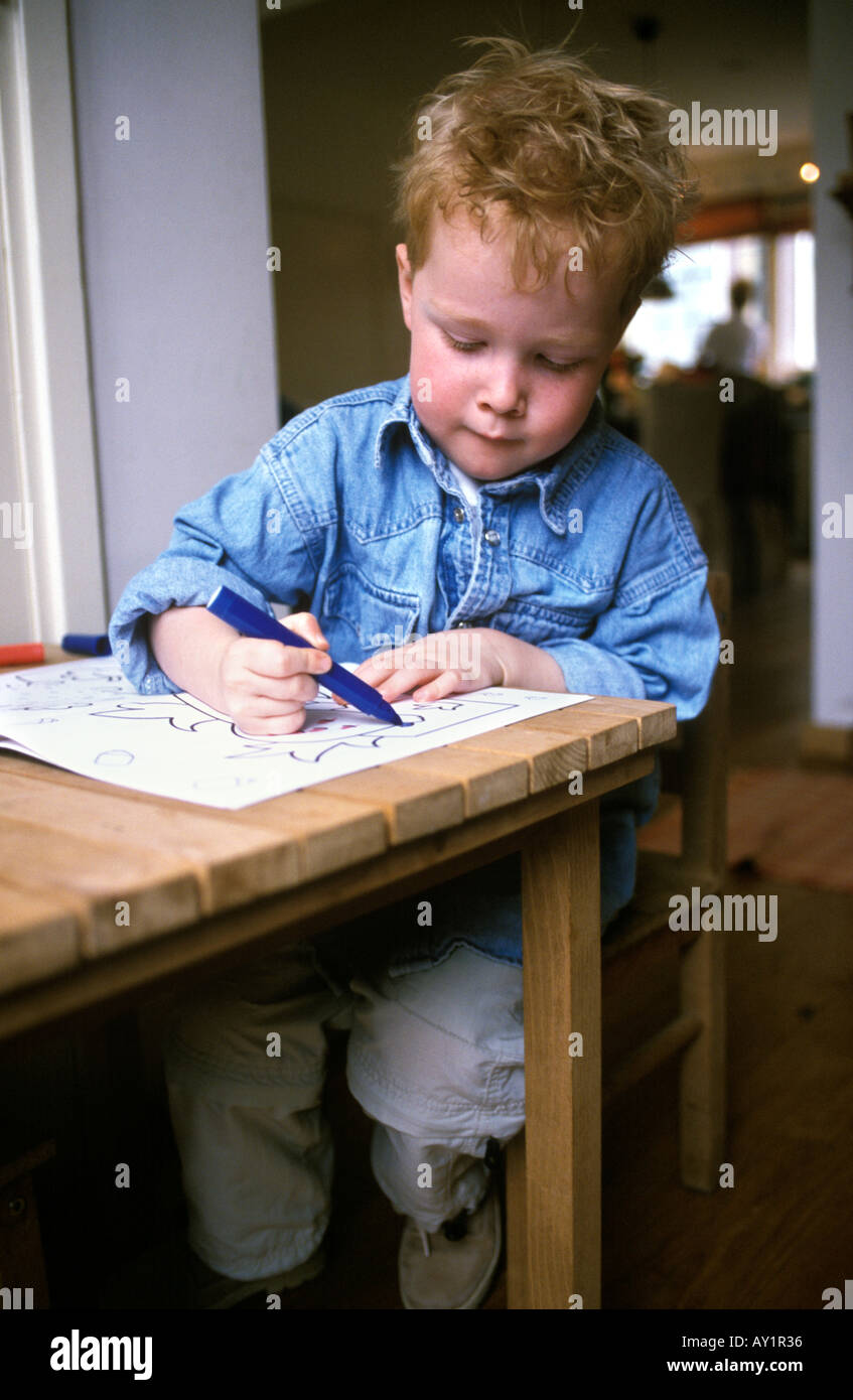 Little boy is making a drawing Stock Photo - Alamy