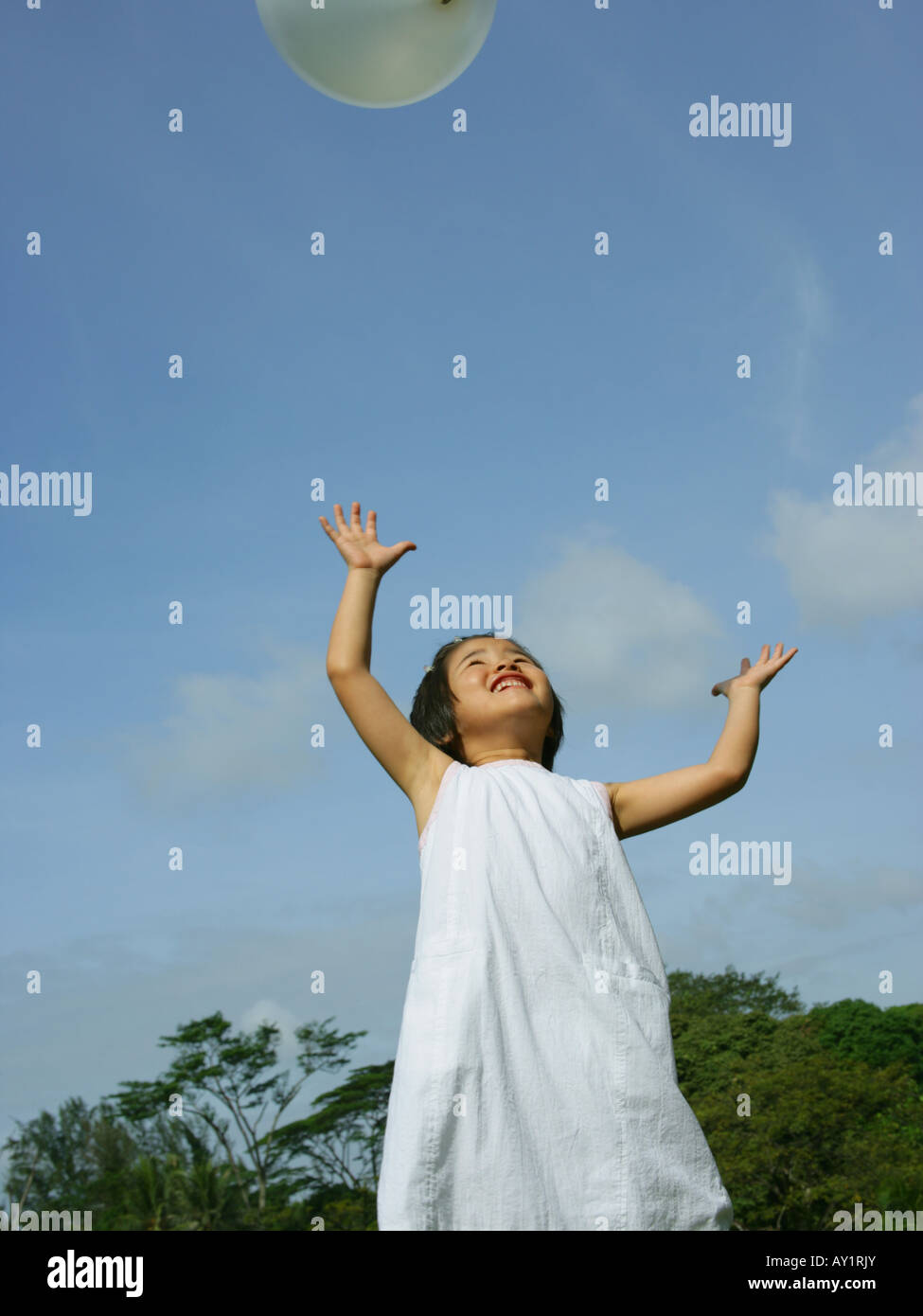 Close-up of a girl catching a balloon Stock Photo - Alamy