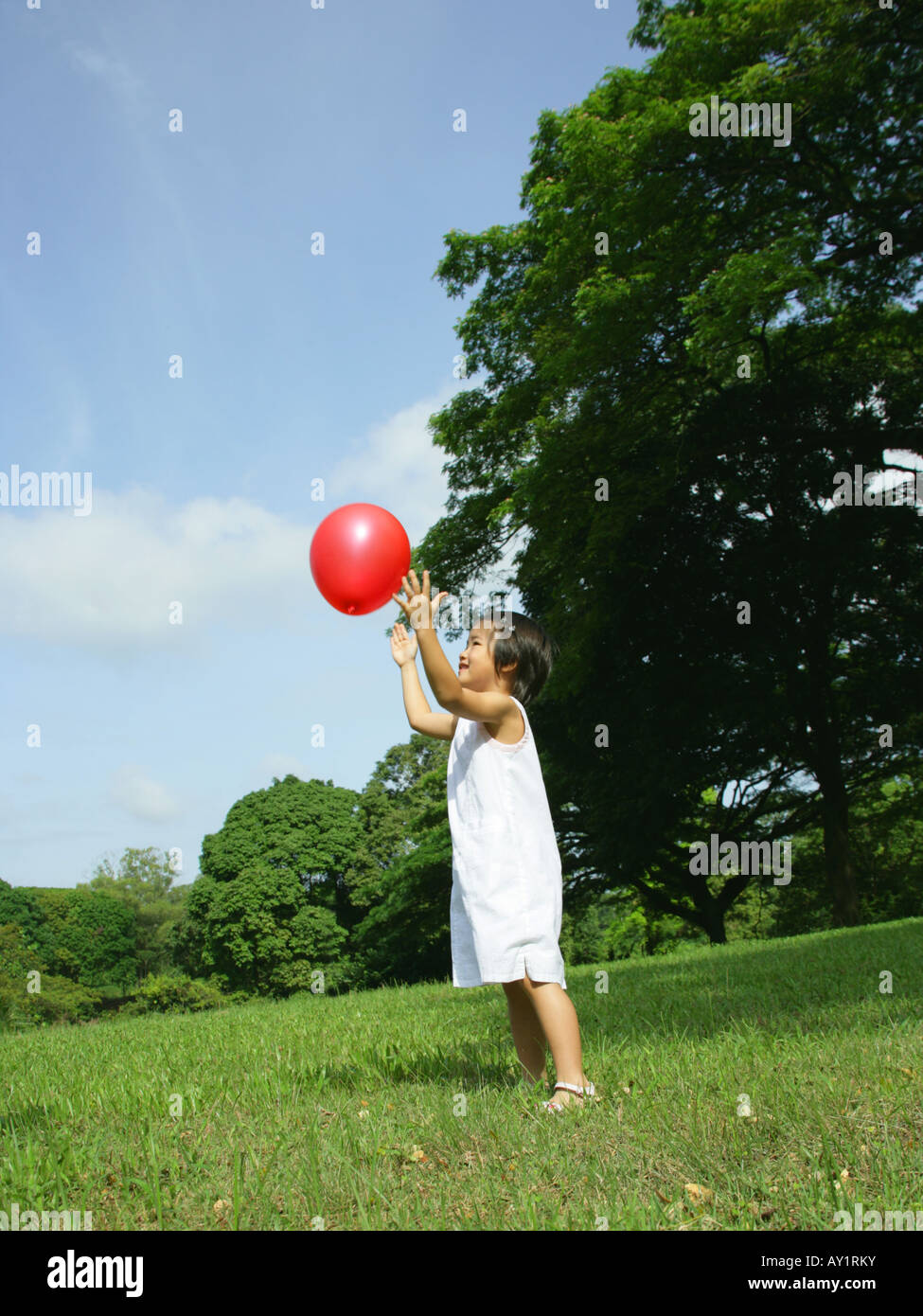 Girl reaching balloon hi-res stock photography and images - Alamy