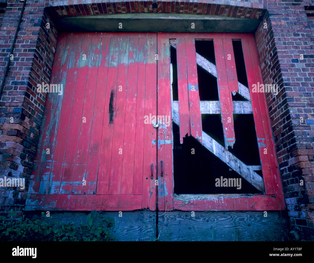 Derelict warehouse doors Stock Photo - Alamy
