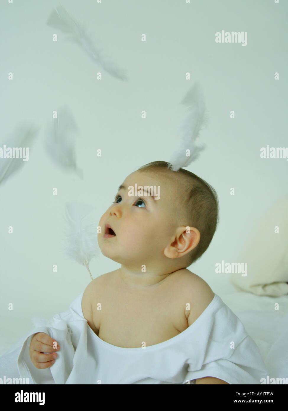 Close-up of a baby girl looking up Stock Photo - Alamy