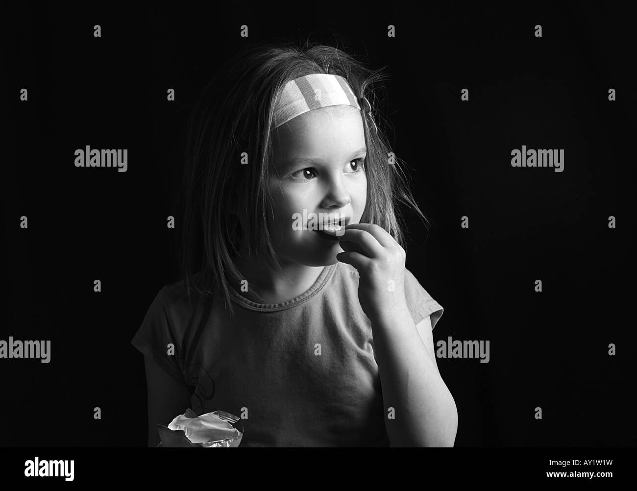 Young Girl Eating a Packet of Crisps Stock Photo - Alamy