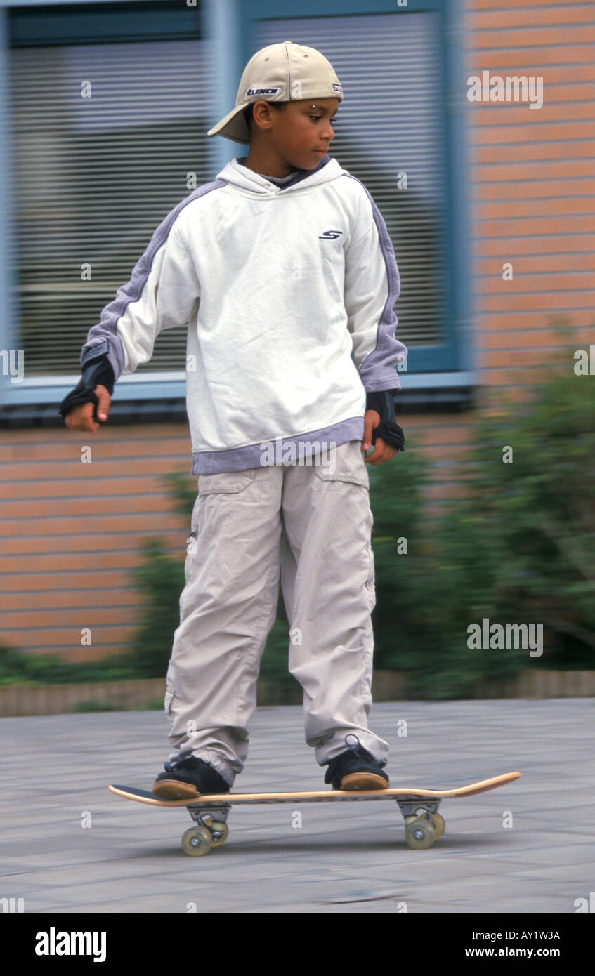 Ethnic boy on a skateboard Stock Photo - Alamy