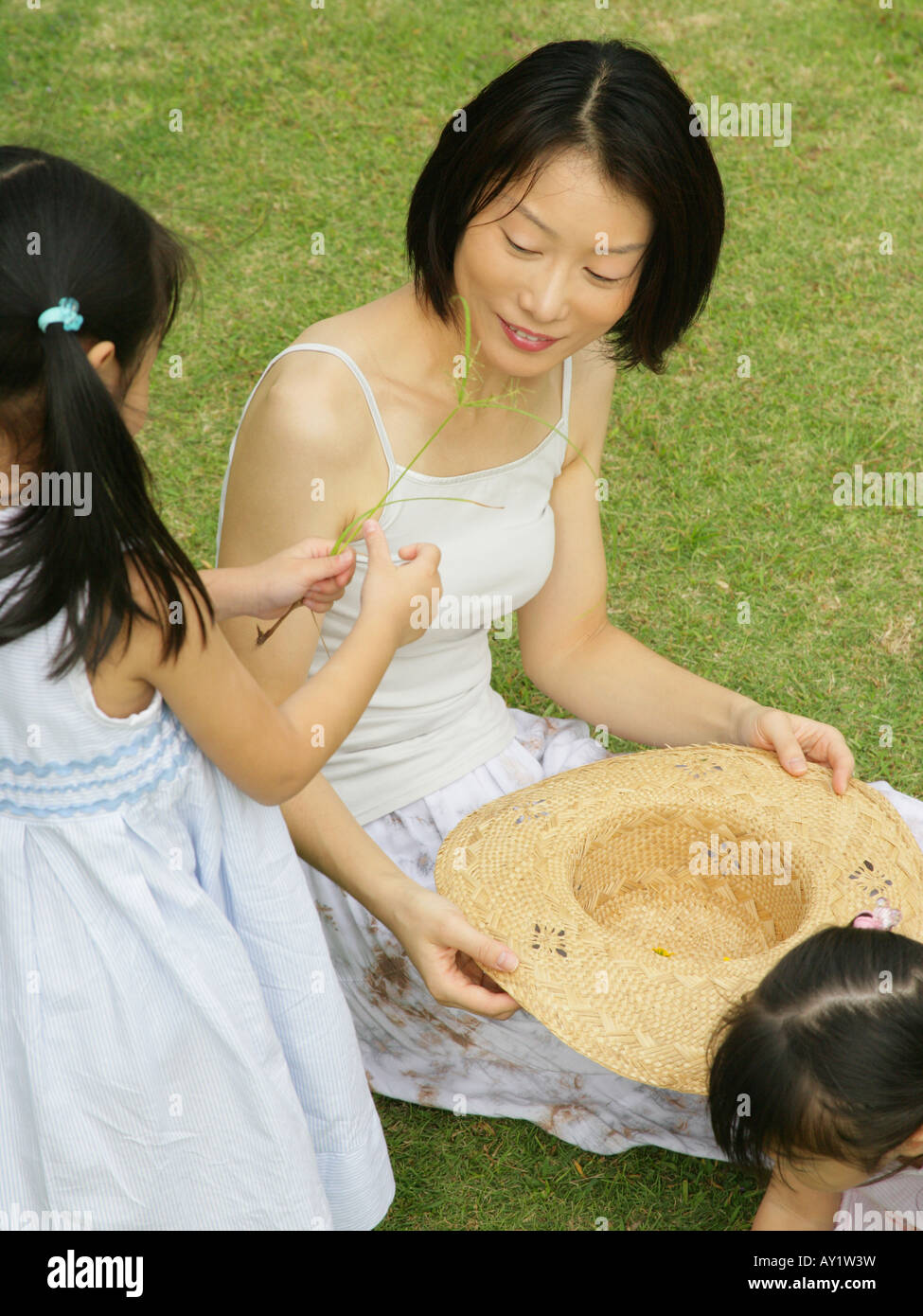 High angle view of a mother and her two daughters Stock Photo - Alamy