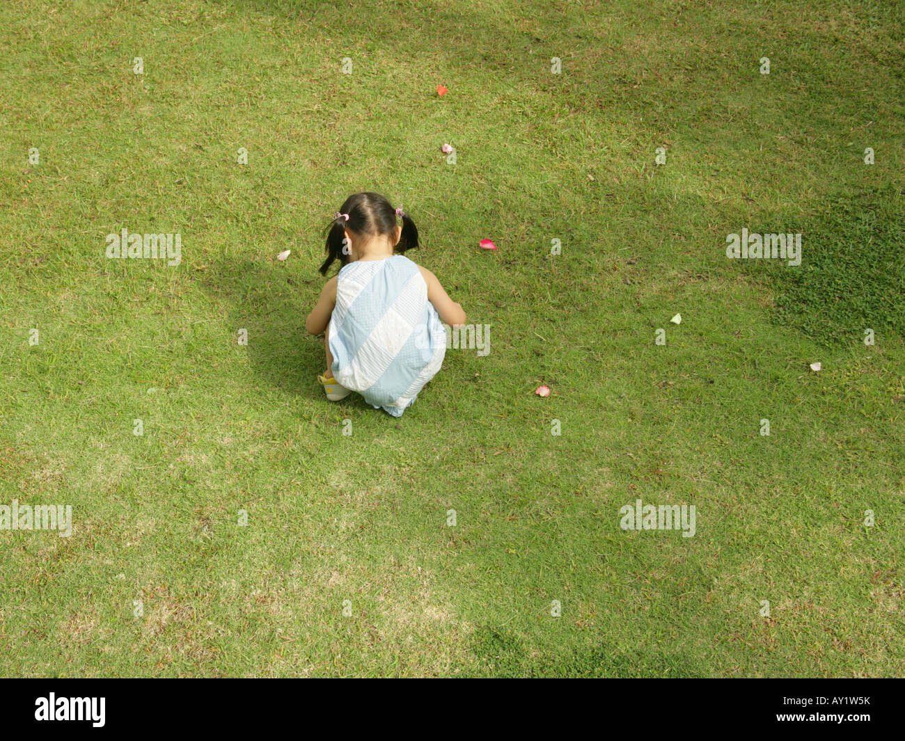 Girl crouching down rear hi-res stock photography and images - Alamy