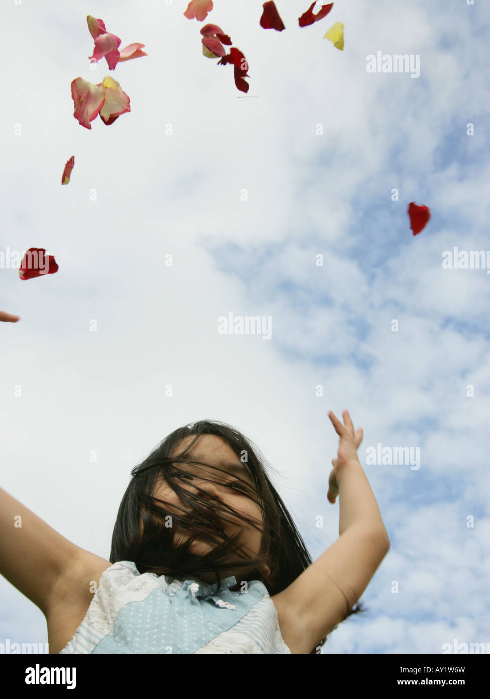 Girl throwing flower petals hi-res stock photography and images - Alamy